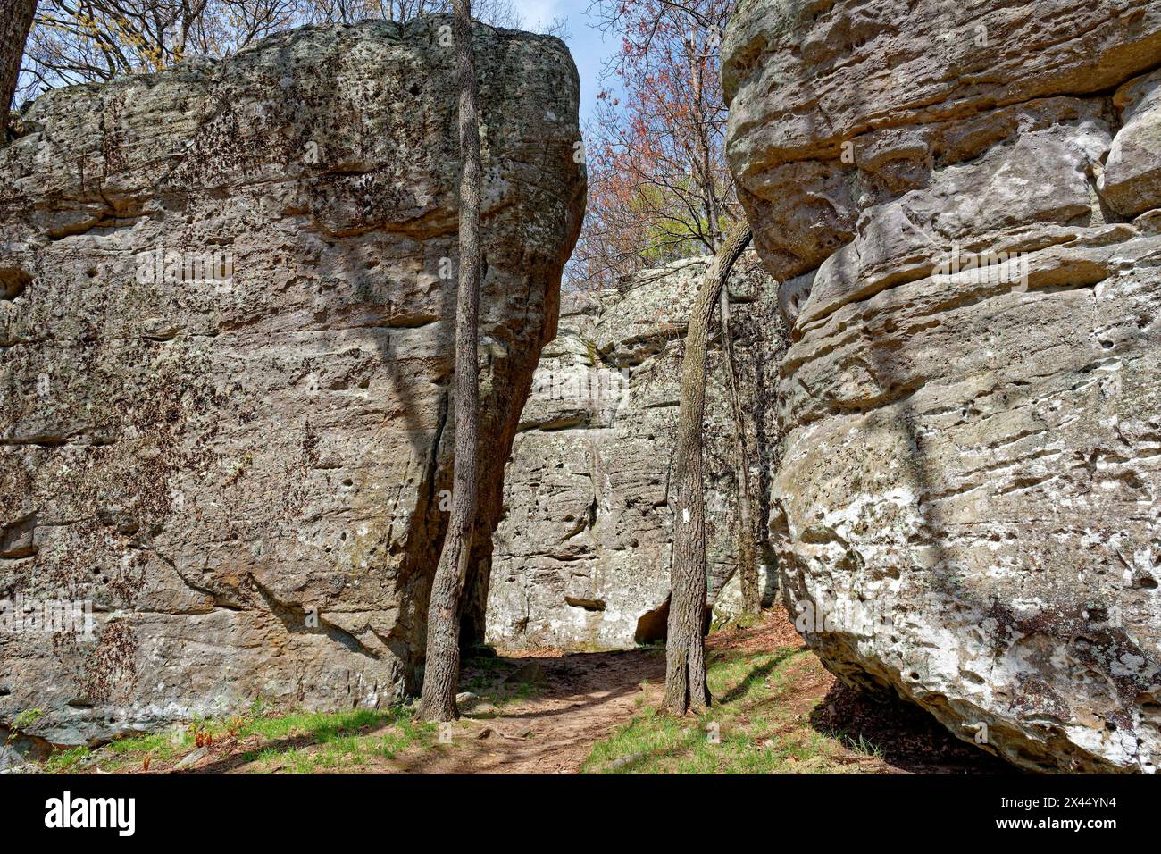 Hiking on a trail through the large boulders on ground level on a ...
