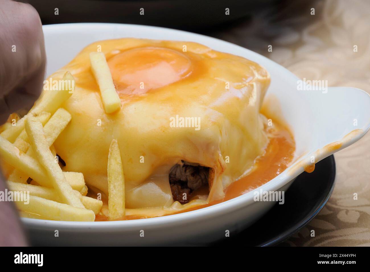 The Francesinha, a sandwich originally from Porto, Portugal with pork ...