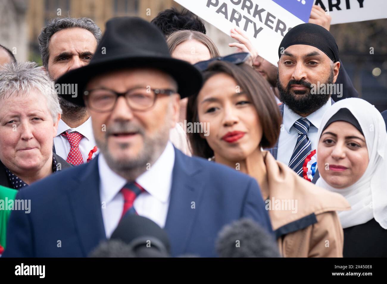 Former England cricketer Monty Panesar (back right) attends a news ...