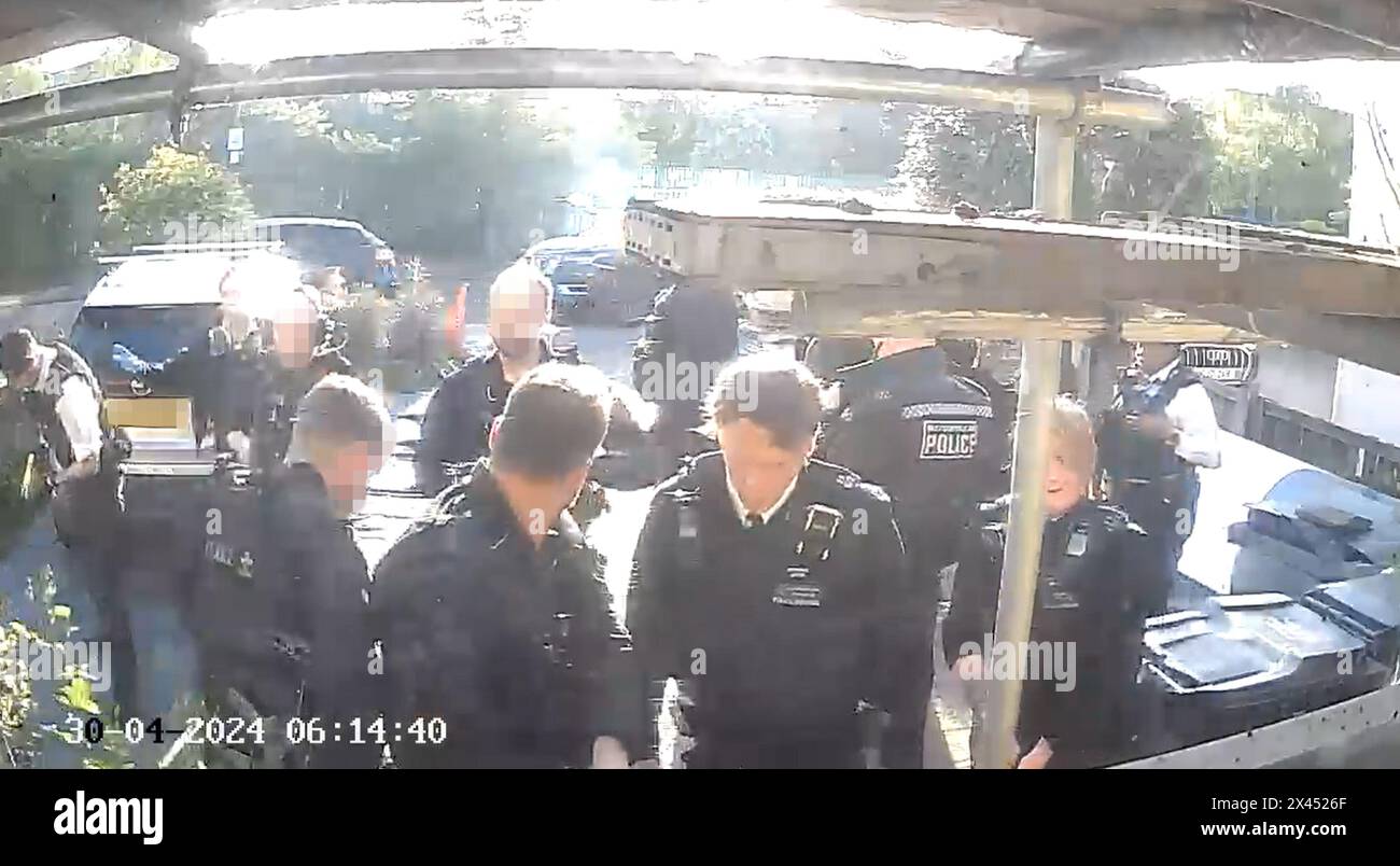 NUMBERPLATE AND FACES OF ARMED POLICE OFFICERS PIXELATED BY PA PICTURE ...