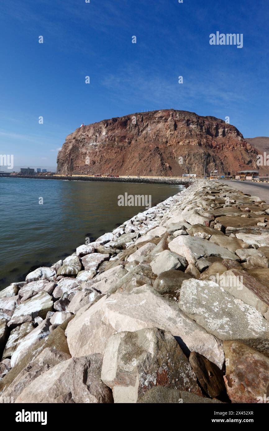 Rock armour revetment preventing coastal erosion next to causeway ...