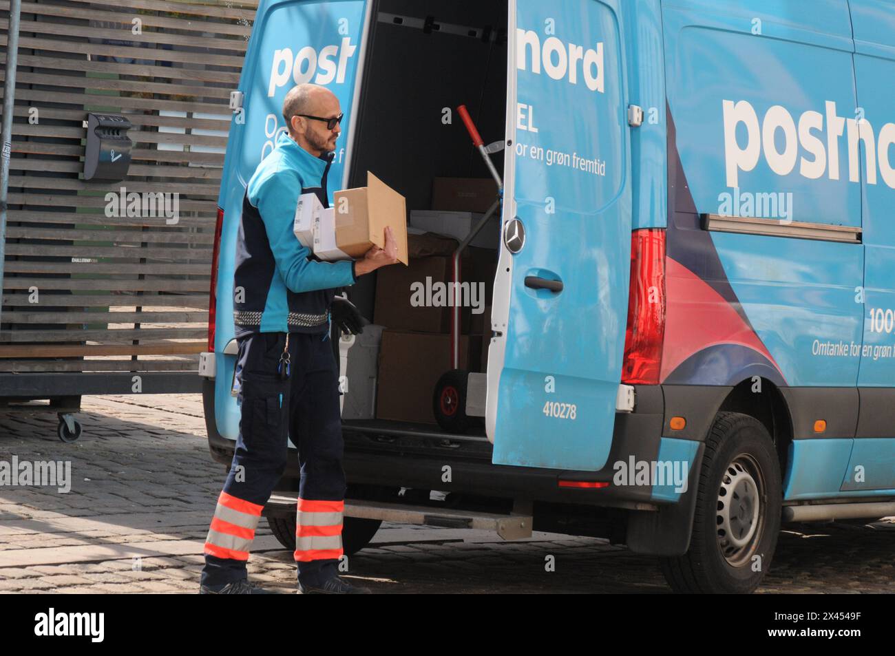 Copenhagen, Denmark /30 April 2024/.Postnord parcels and packets ...