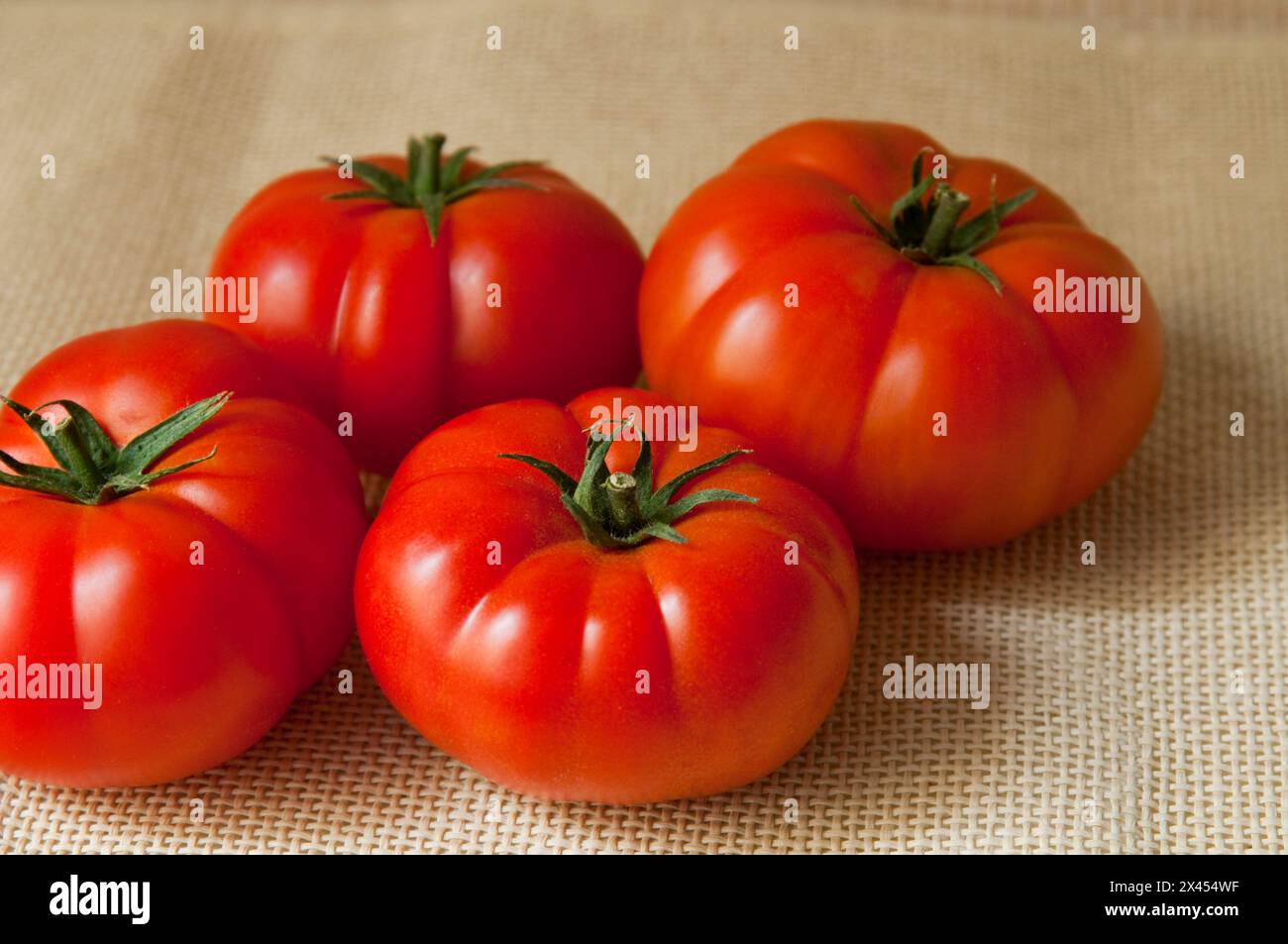 Four tomatoes. Still life Stock Photo - Alamy