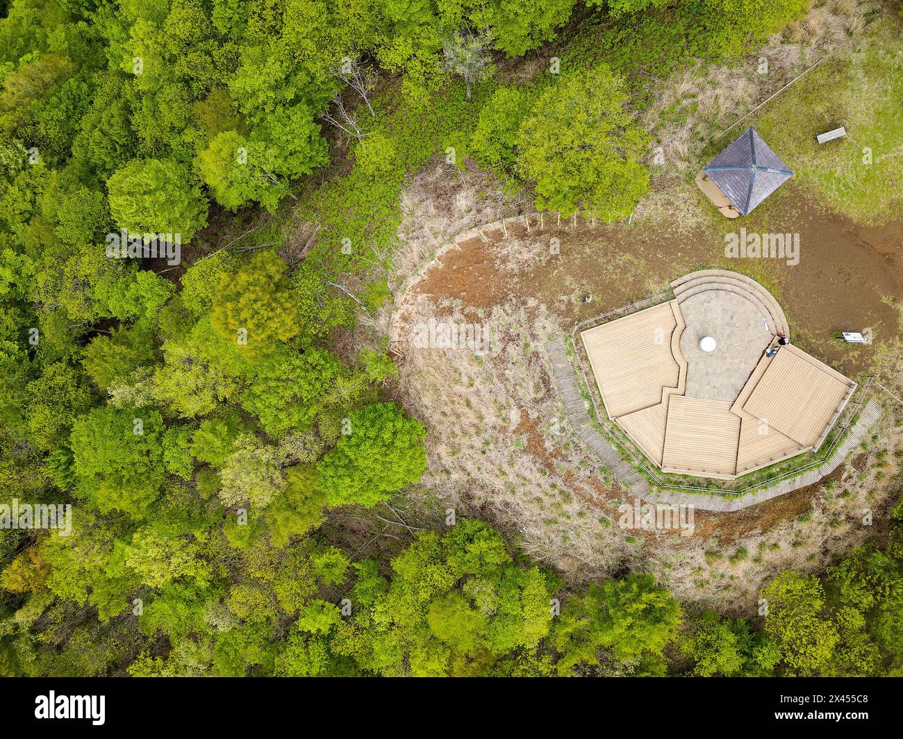 Birds eye aerial view of an observation deck in the middle of a lush ...