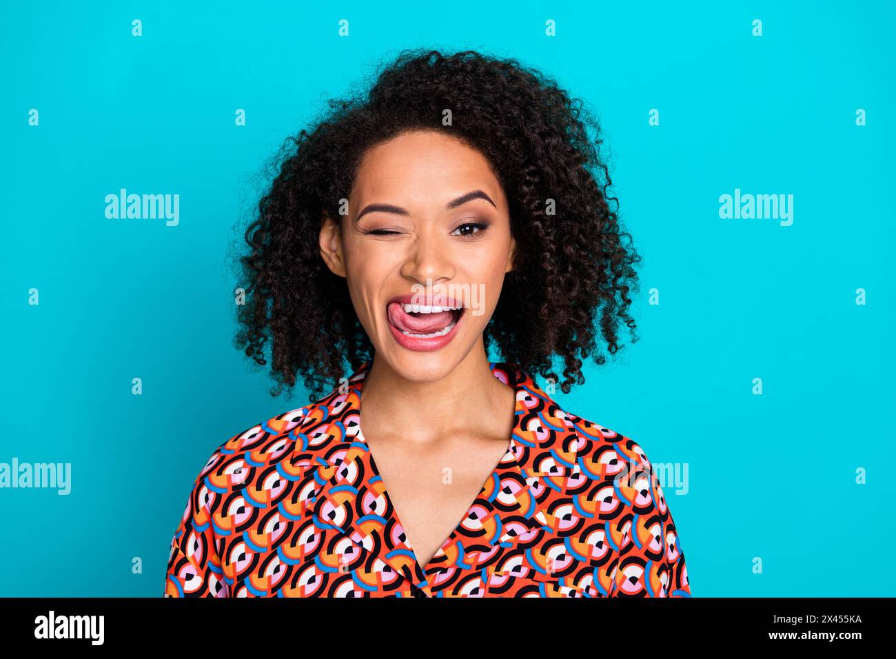Photo of charming flirty lady wear print shirt licking lios stick out ...