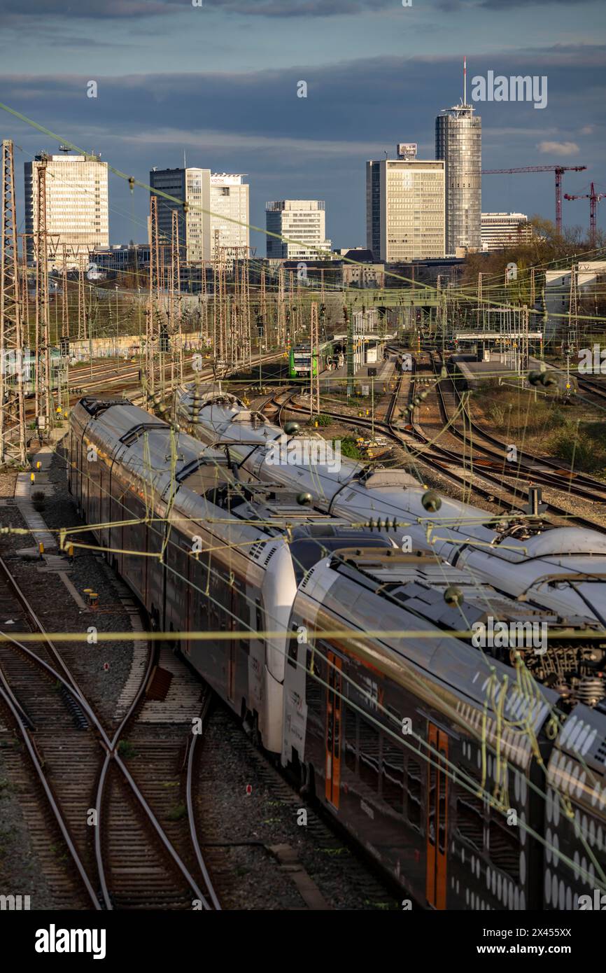 Train on the tracks west of Essen central station, skyline of the city ...