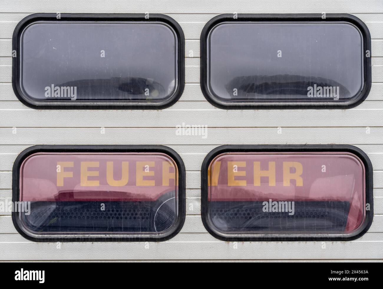 Fire department equipment shed, fire engine in the hall, closed gate ...