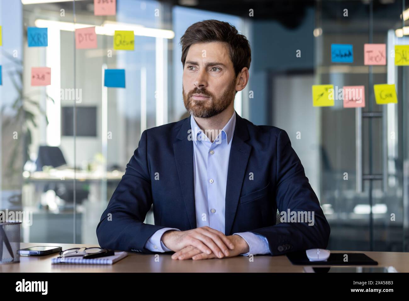 Man in colorful attire sits hi-res stock photography and images - Alamy