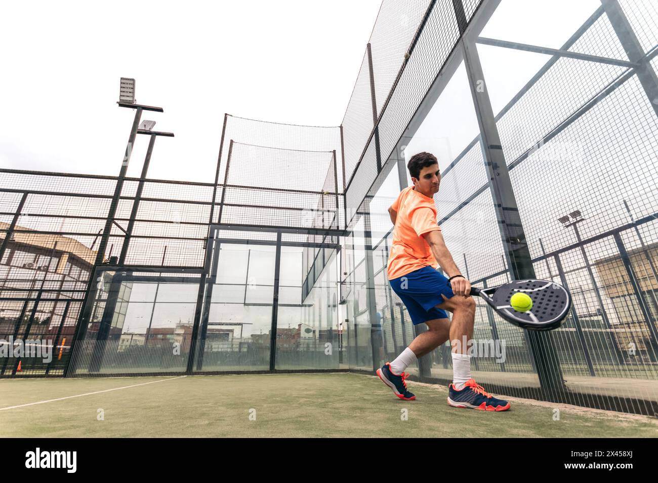 young man playing paddle tennis. low angle Stock Photo - Alamy