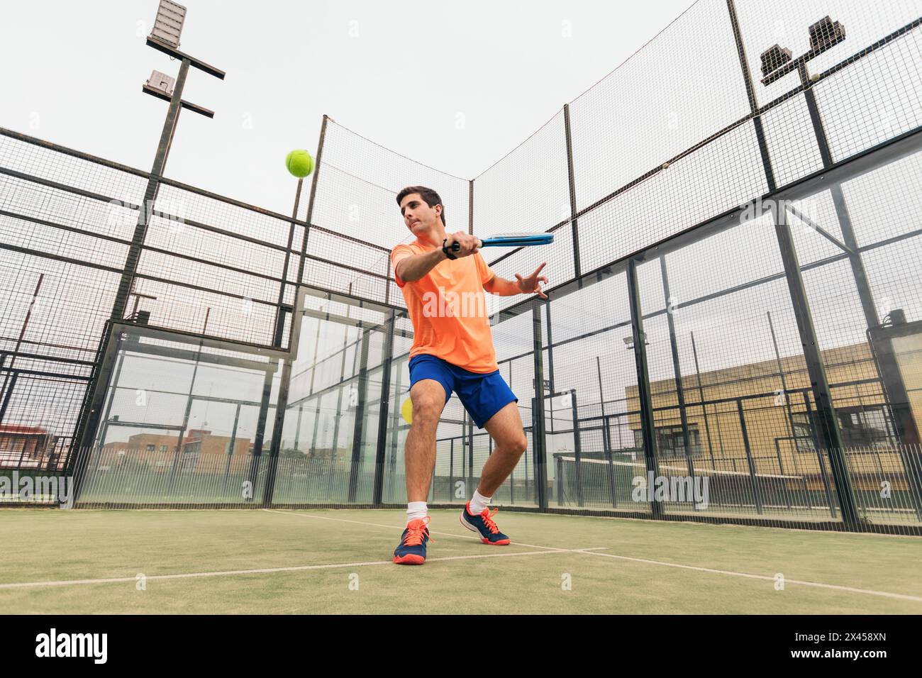 man playing paddle tennis. backhand Stock Photo - Alamy