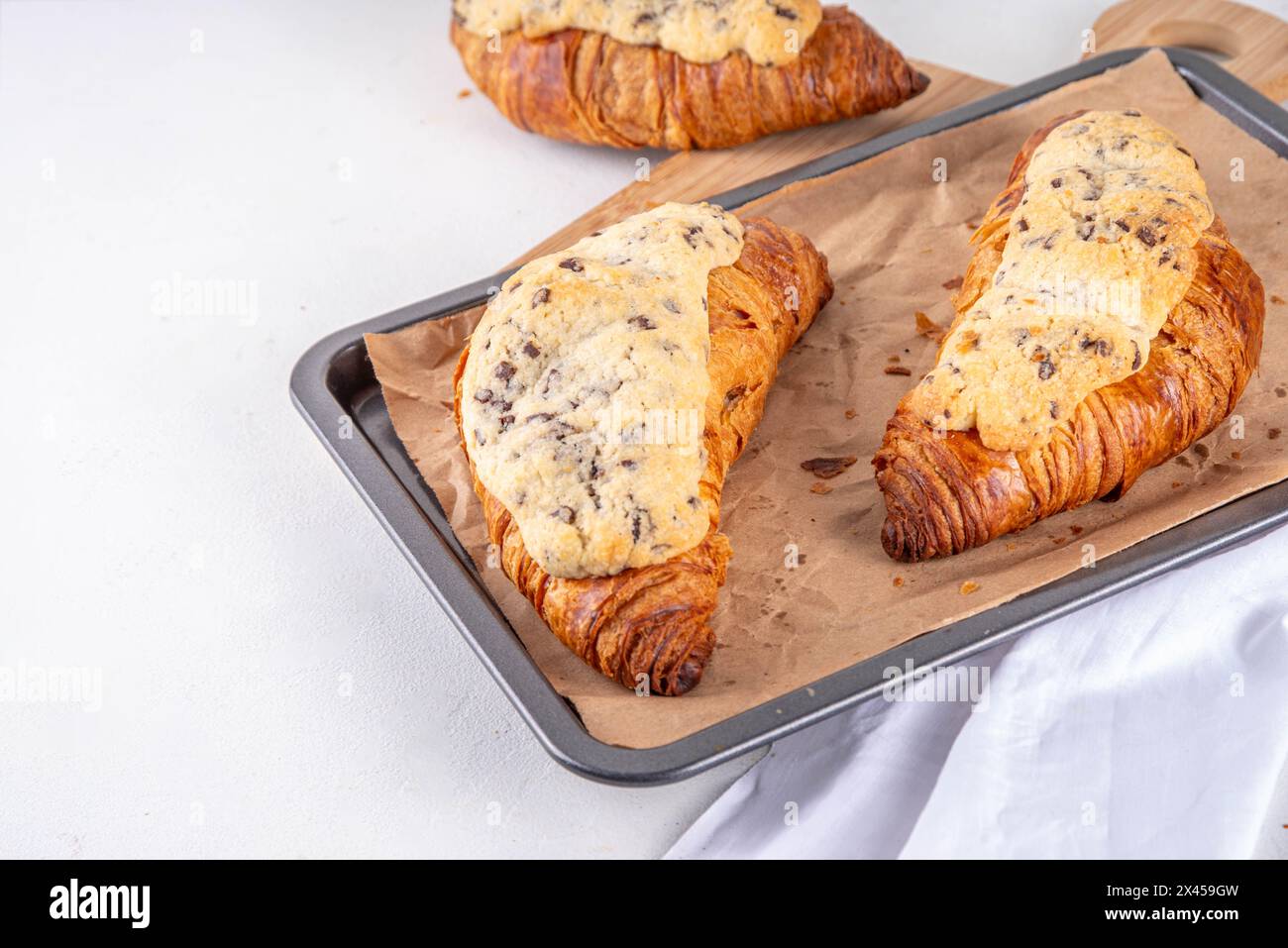 Trendy French sweet dessert pastry crookie, a hybrid of croissant with ...