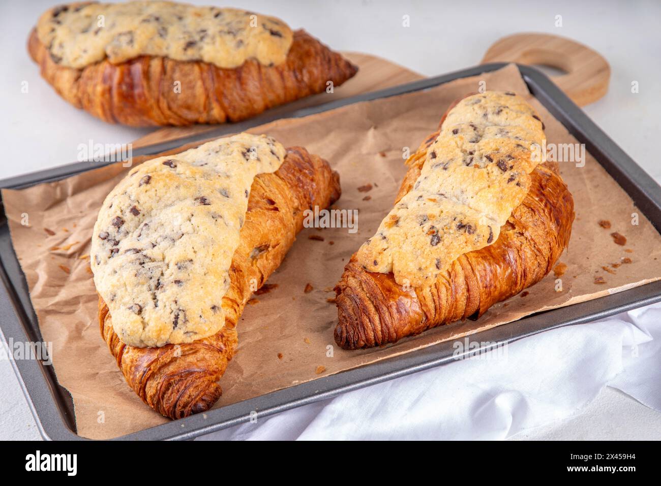 Trendy French sweet dessert pastry crookie, a hybrid of croissant with ...