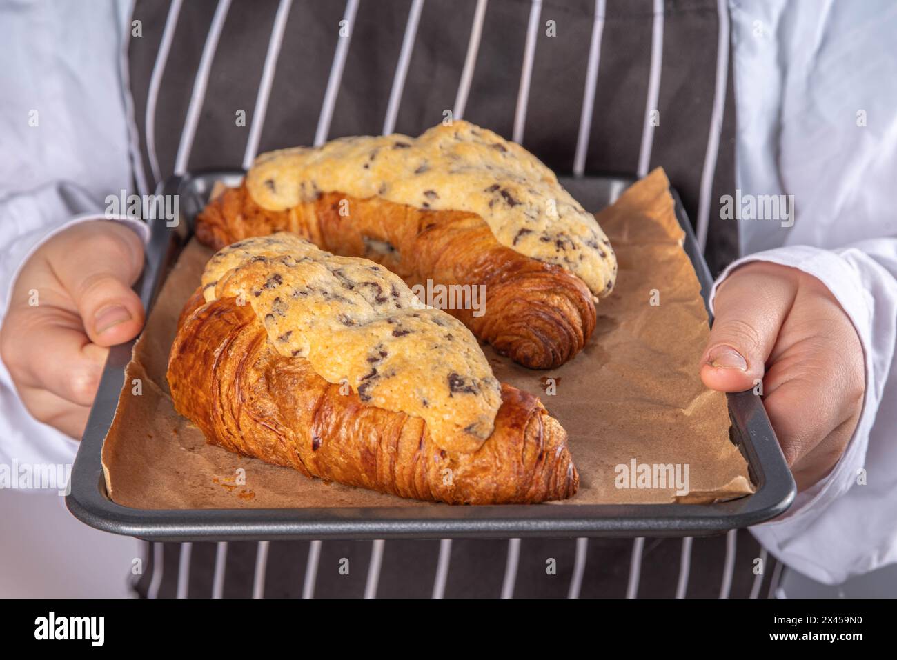 Trendy French sweet dessert pastry crookie, a hybrid of croissant with ...