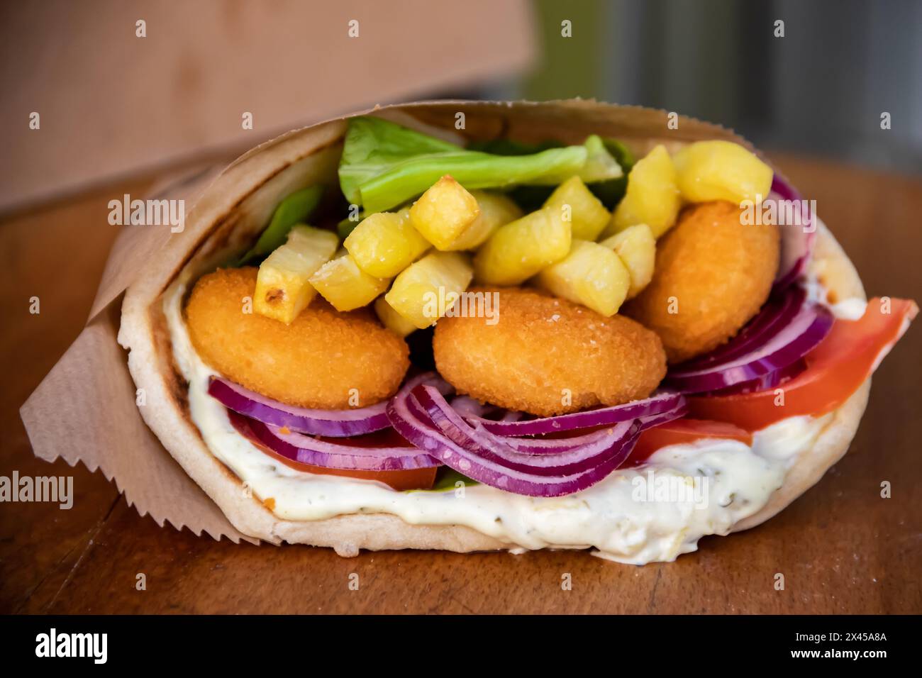 Chicken nugget wrap sandwich bursting with crispy onion, golden French ...