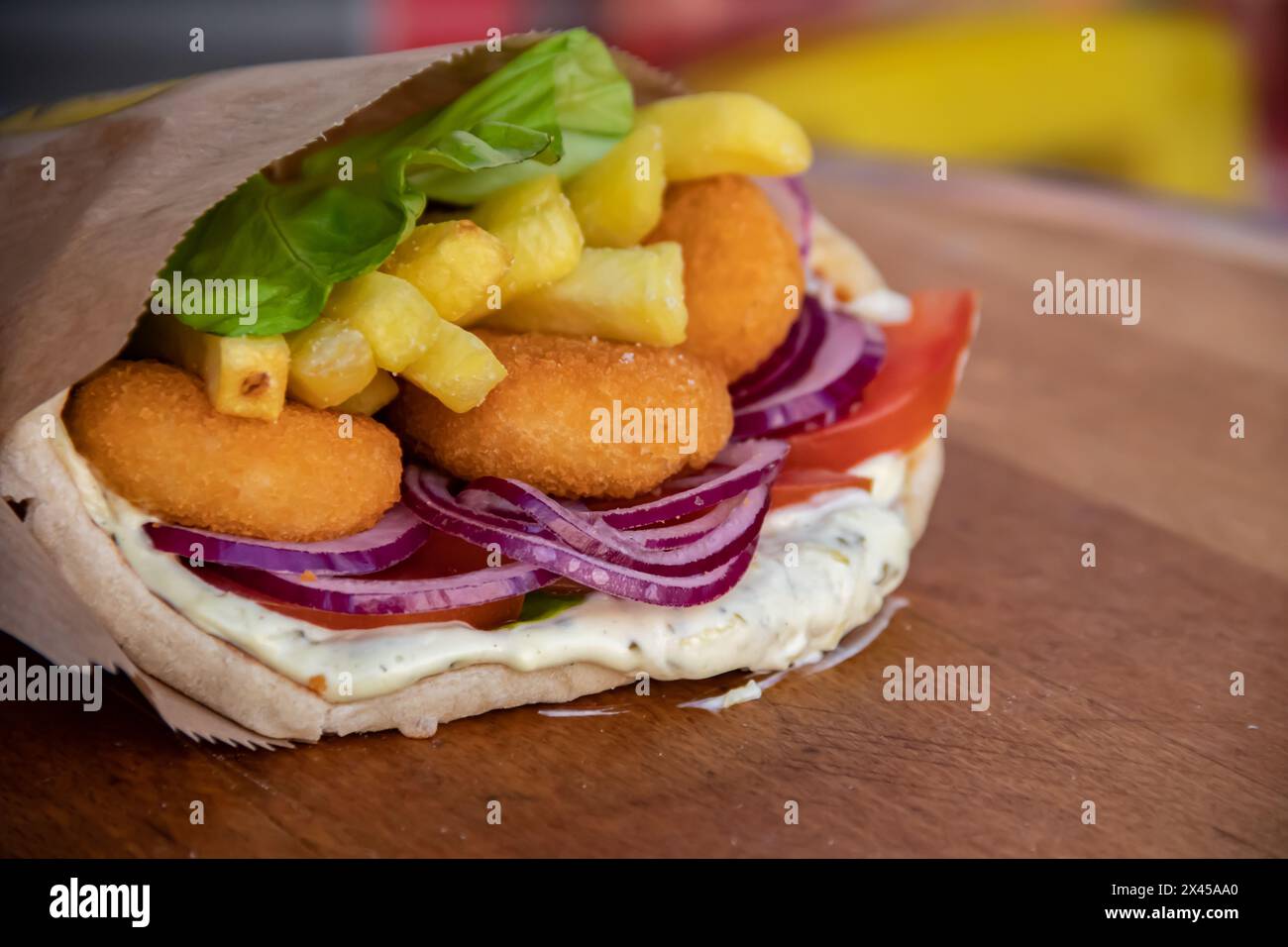 Chicken nugget wrap sandwich bursting with crispy onion, golden French ...