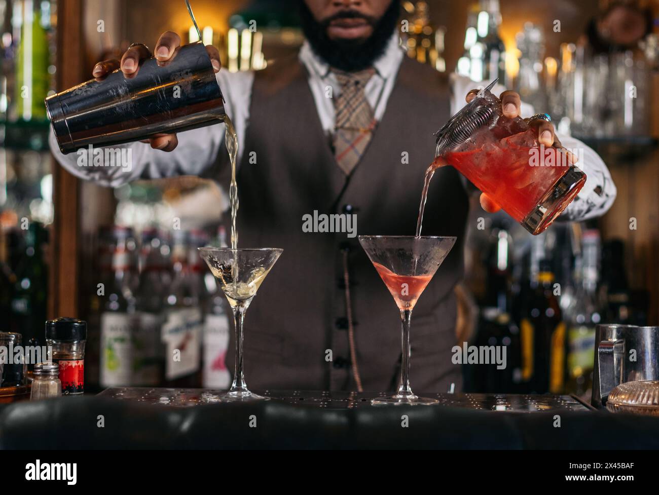 The magic of mix: a bartender mixing up his best creations with flair ...