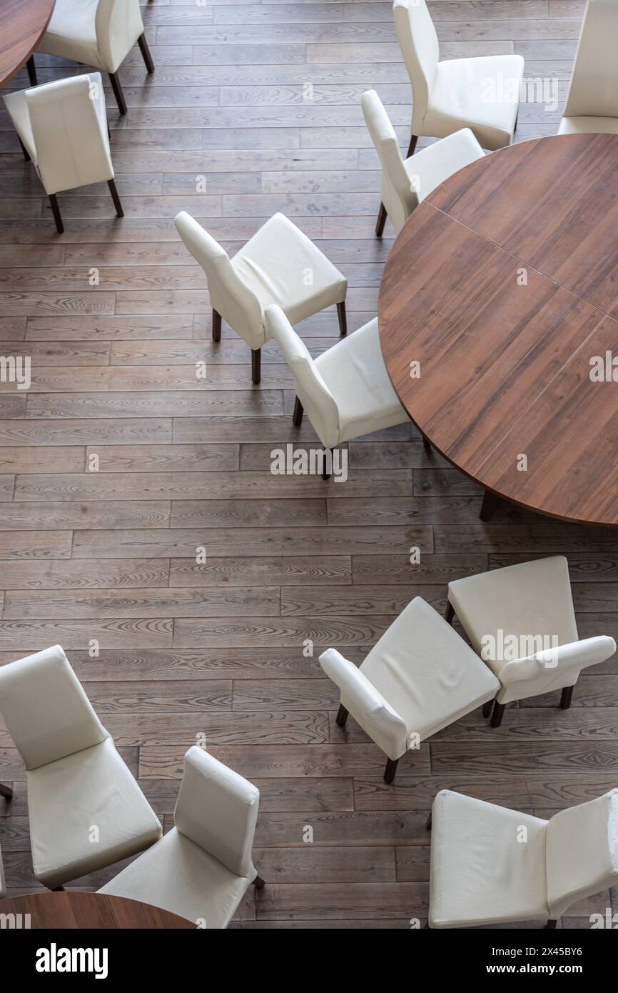 Abstract modern interior of cafe or meeting room with rounded armchairs ...