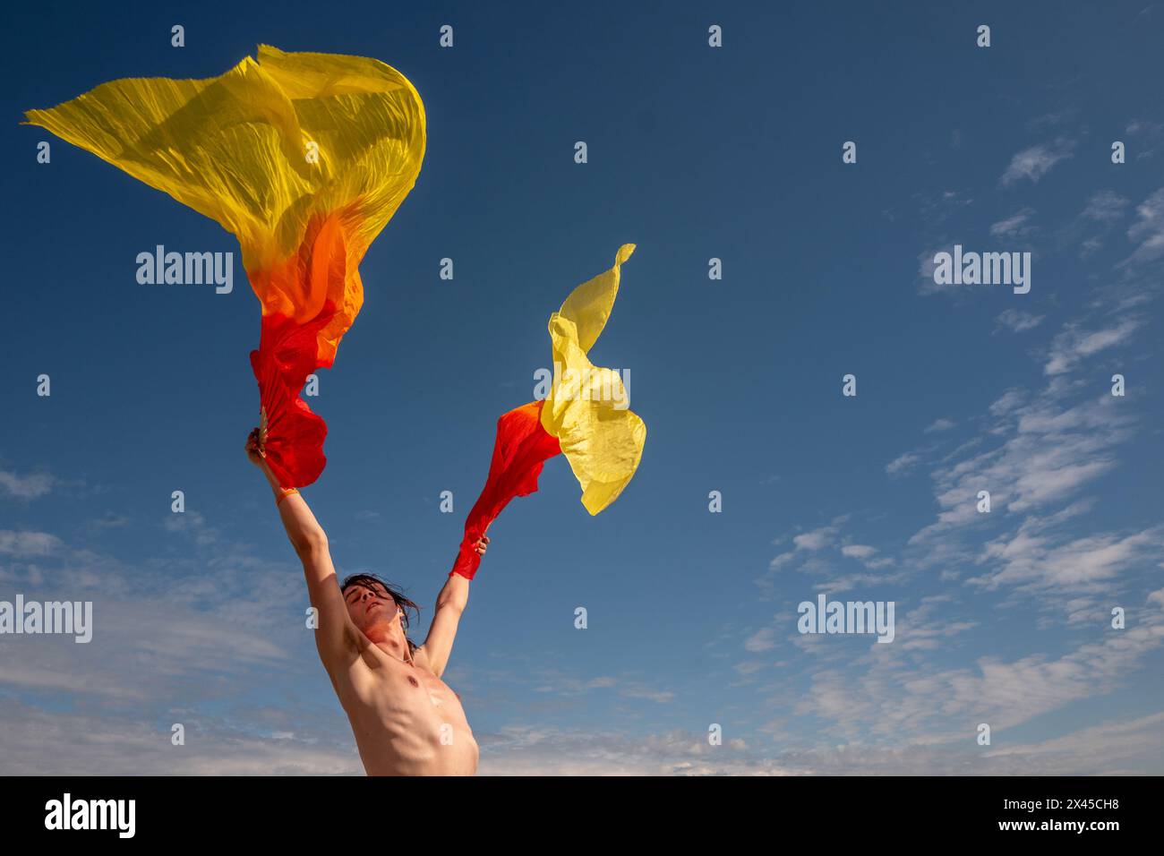Brighton, April 30th 2024: A young man fan-dancing in the beautiful ...