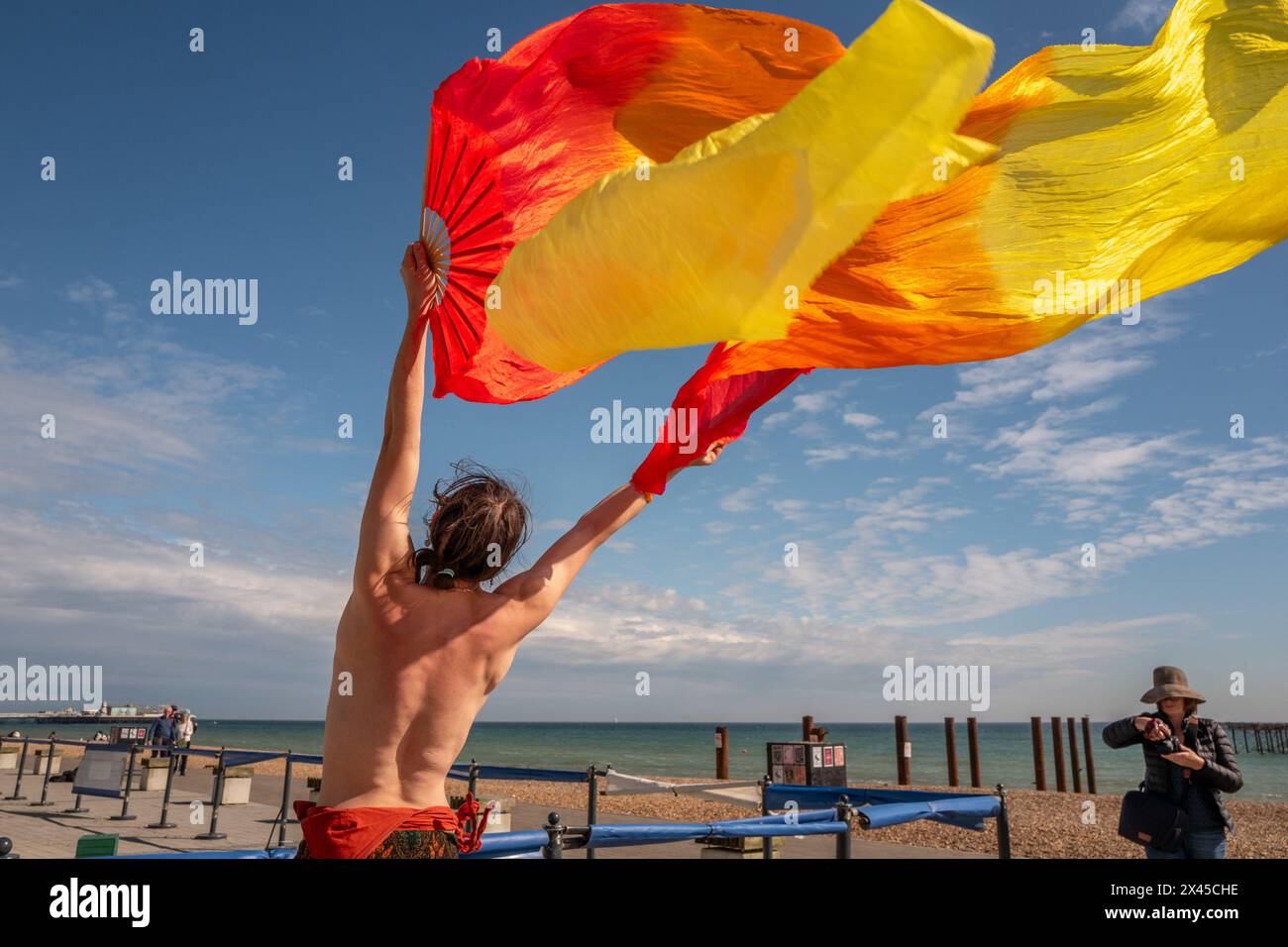 Brighton, April 30th 2024: A young man fan-dancing in the beautiful ...