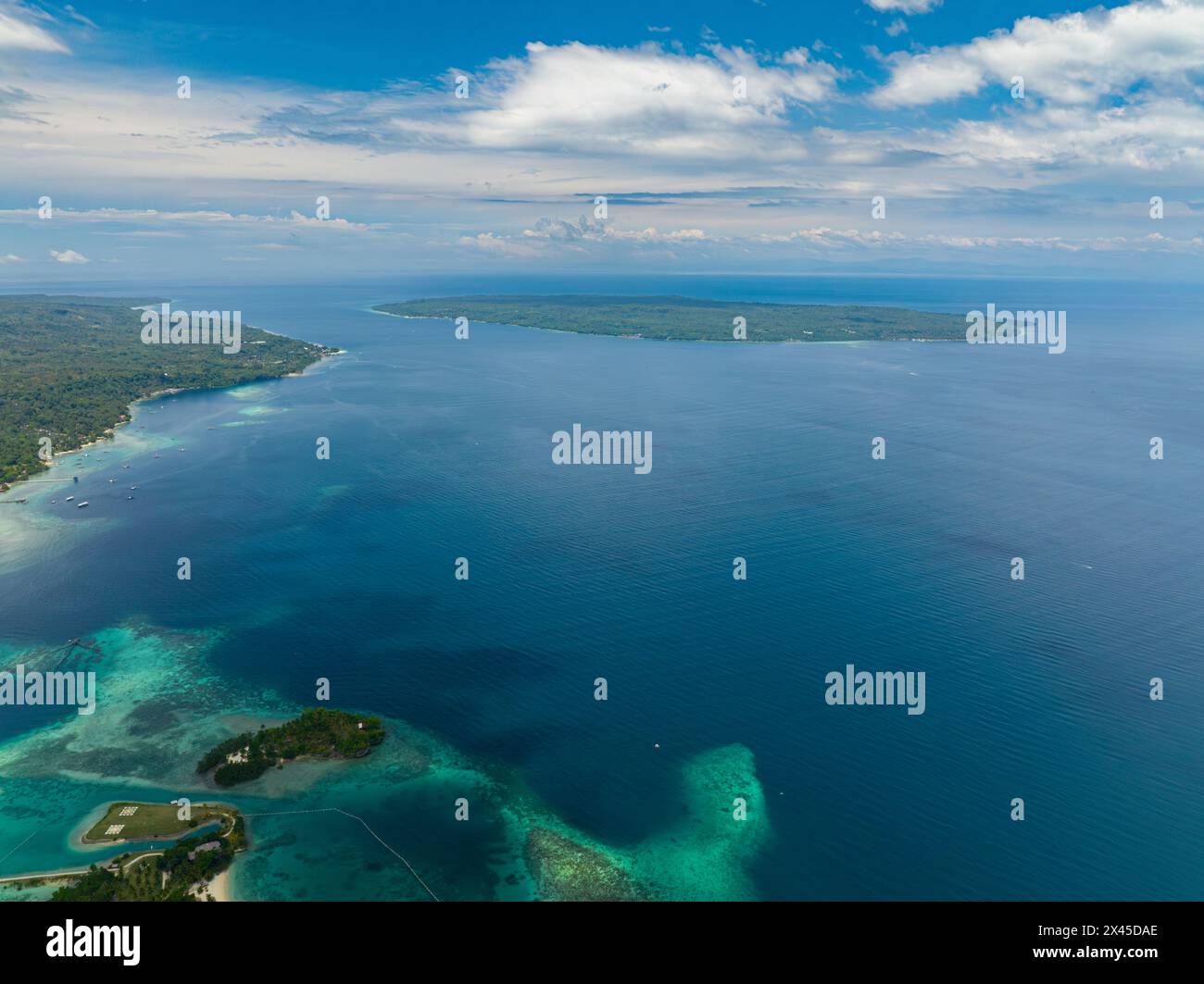 Blue sea and tropical island. Blue sky and clouds. Samal, Philippines ...