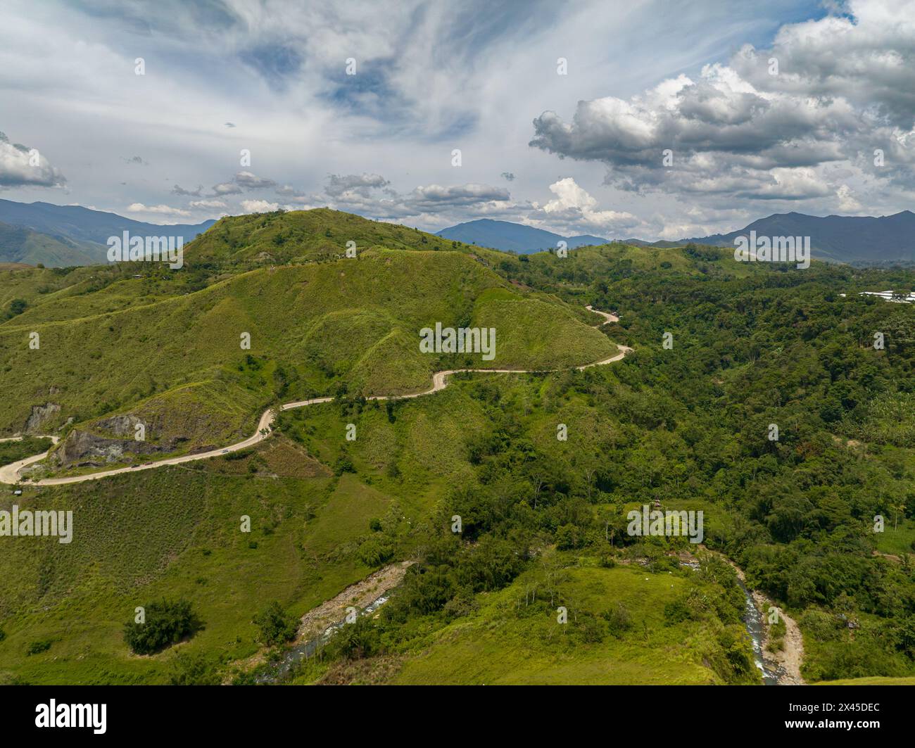 Tropical mountain valley and mountain asphalt road. Rainforest with ...