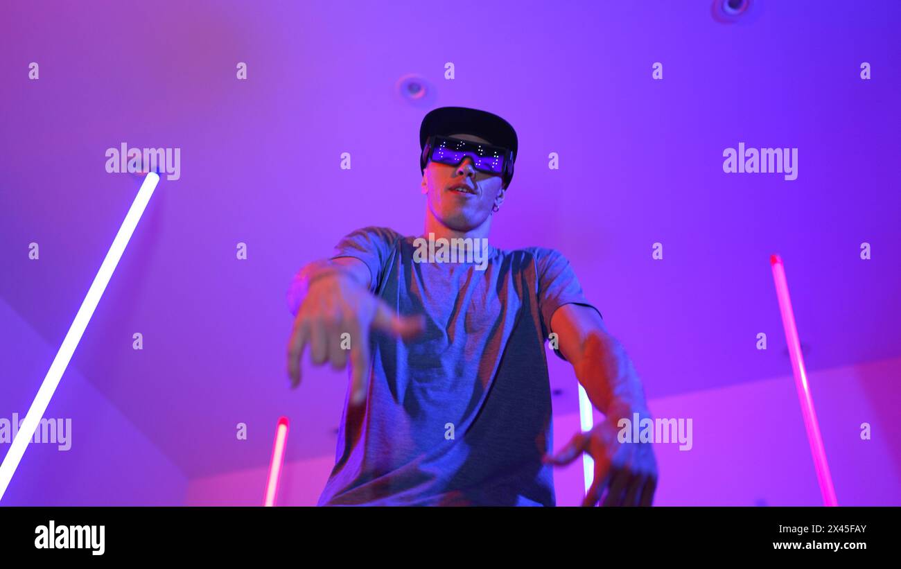 Low angle camera of caucasian dancer wearing fancy glasses and ...