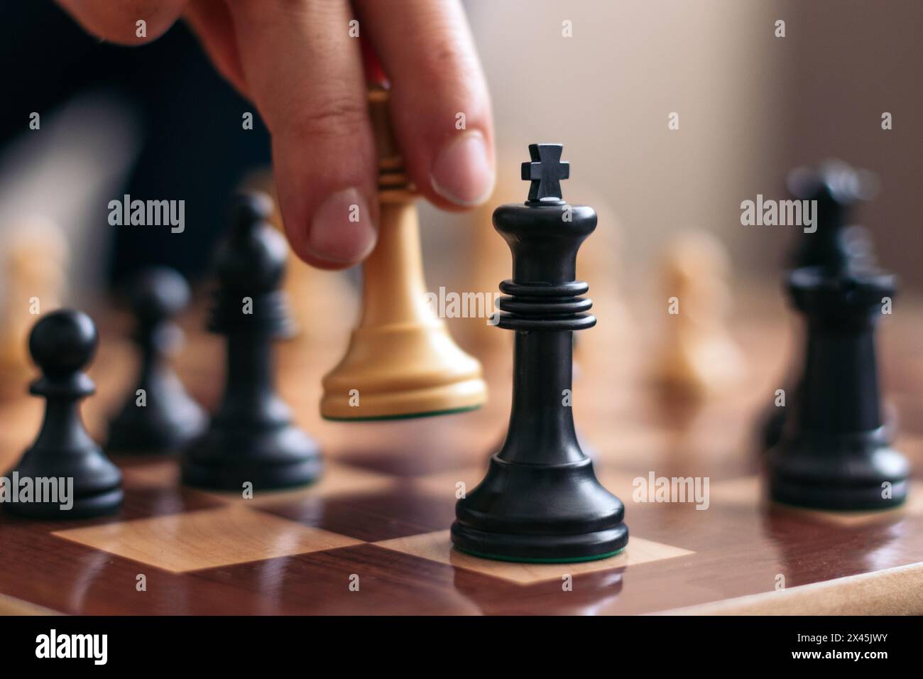 Checkmate. Hand of an unrecognizable man playing chess checkmating his ...
