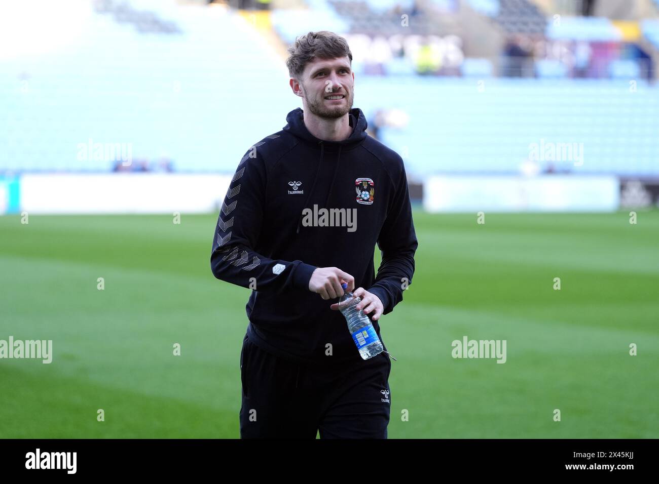 Coventry City goalkeeper Bradley Collins inspects the pitch ahead of ...