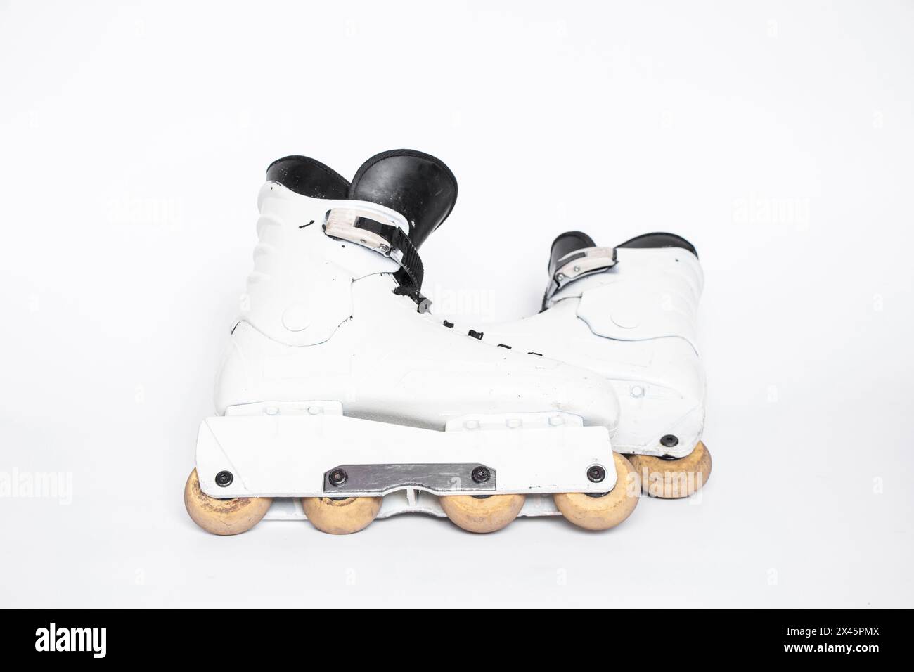 Aggressive roller skates for extreme skating, old, lie on a white ...
