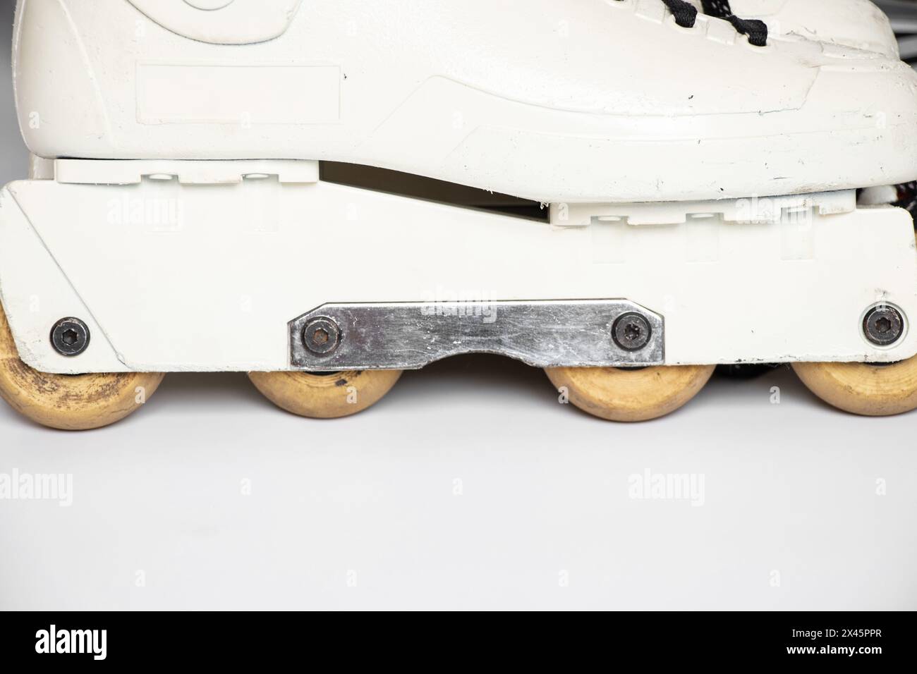 Aggressive roller skates for extreme skating, old, lie on a white ...