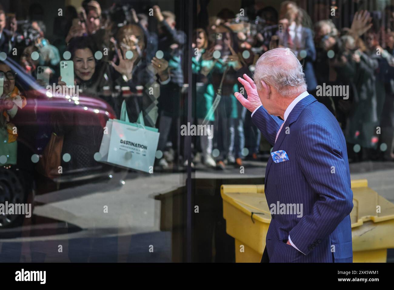 London, UK. 30th Apr, 2024. HRH King Charles III waves at people inside ...