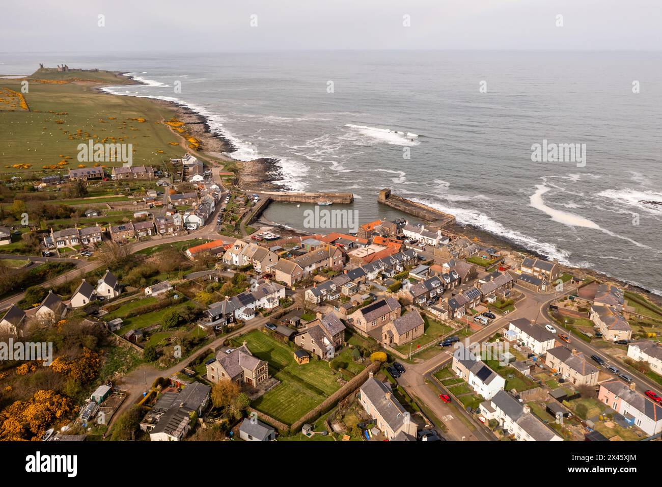 Aerial landscape panorama of the Northumberland fishing village of ...