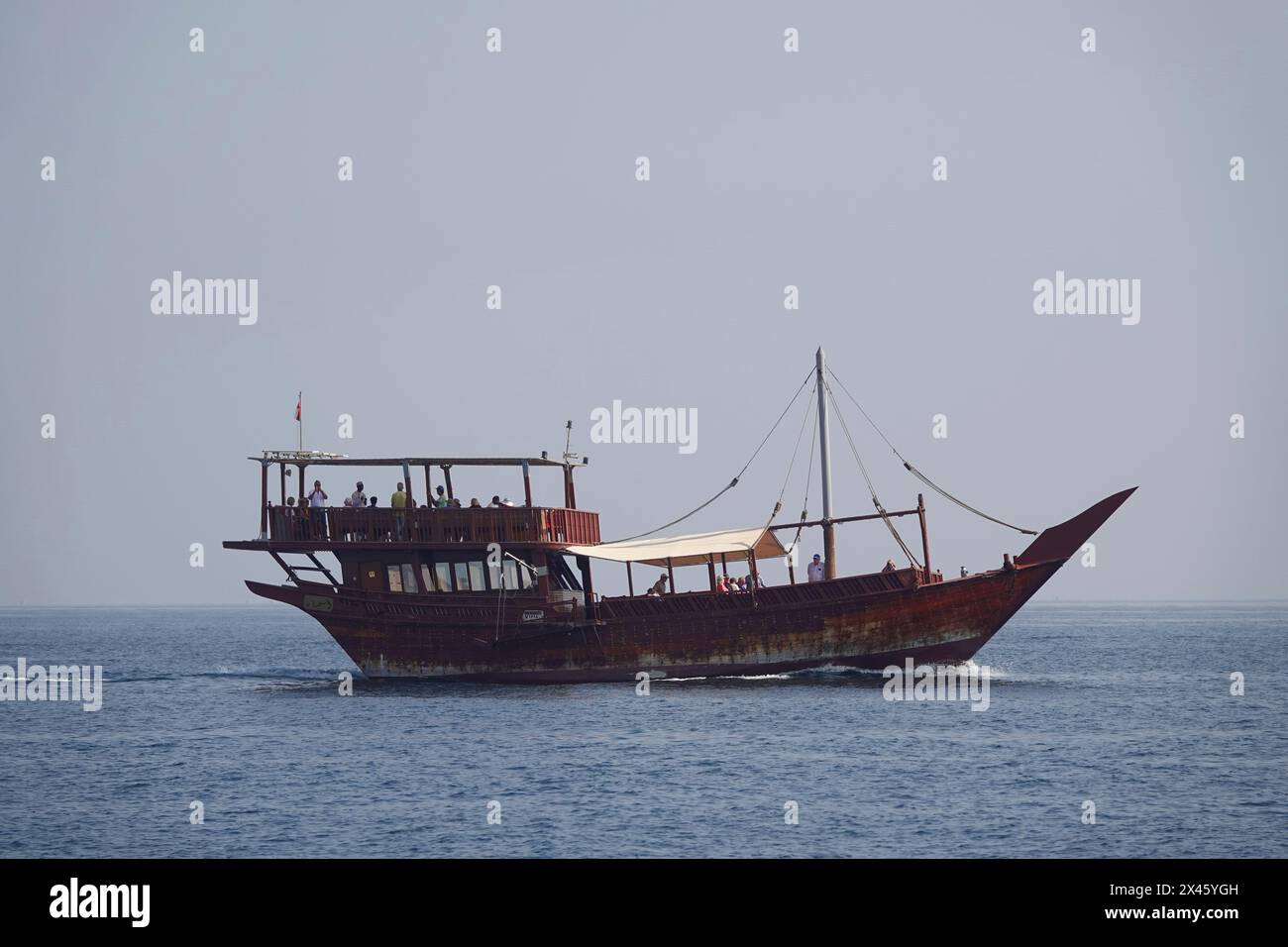 A traditional Arabian sailing dhow carrying tourist passengers Stock ...