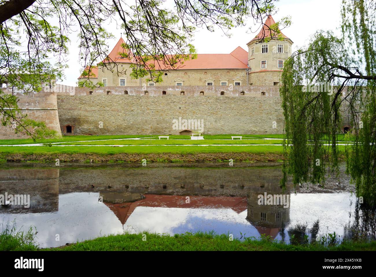 View of the Fagaras fortress in Romania: a landscape with a water ...