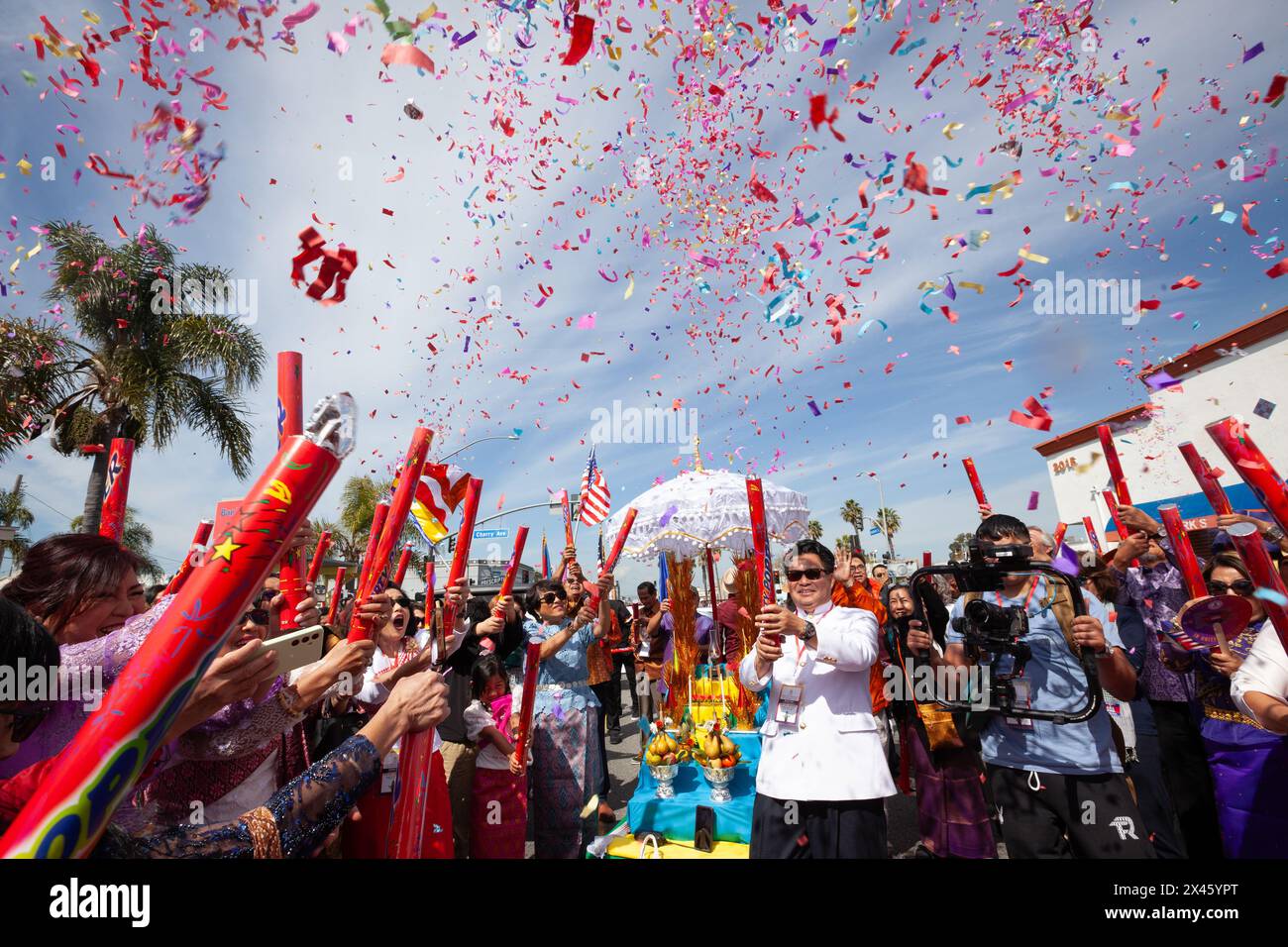 People shoot hundreds of tubes of confetti into the sky to kick off the Cambodian New Year ...