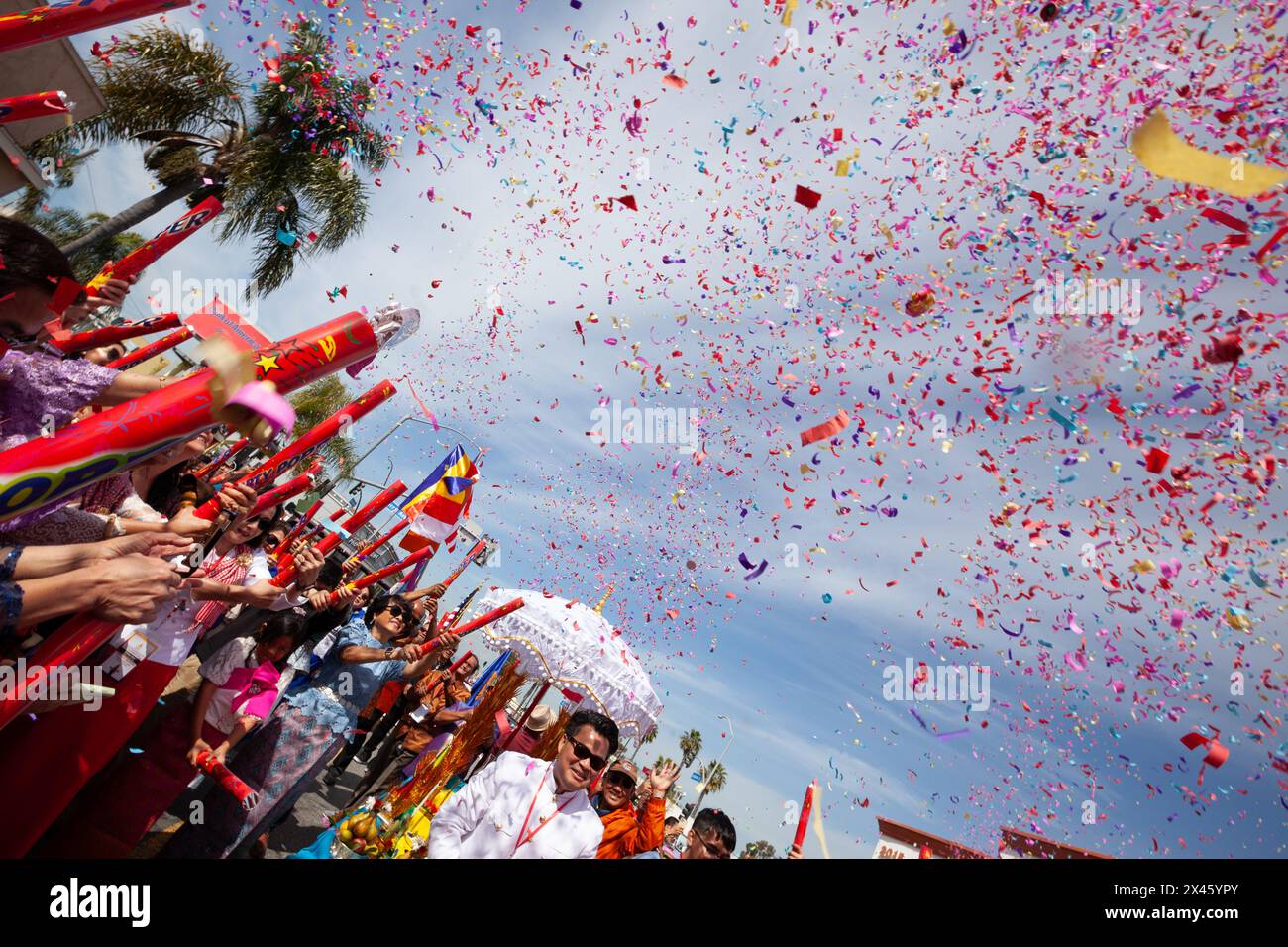 People shoot hundreds of tubes of confetti into the sky to kick off the Cambodian New Year ...