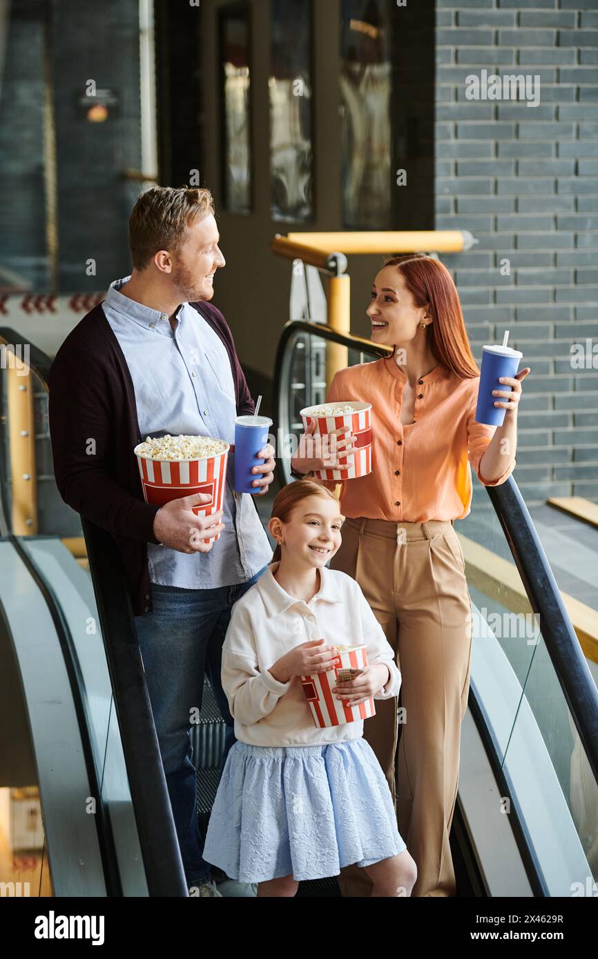 Family of three stands together hi-res stock photography and images - Alamy