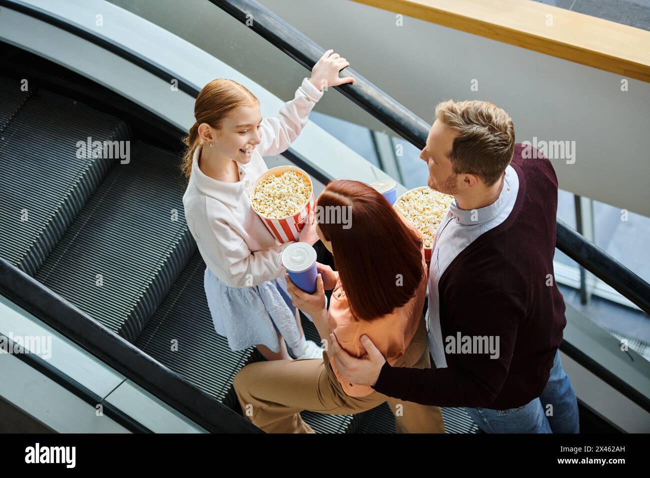 A group of people, including a happy family, standing together on an ...