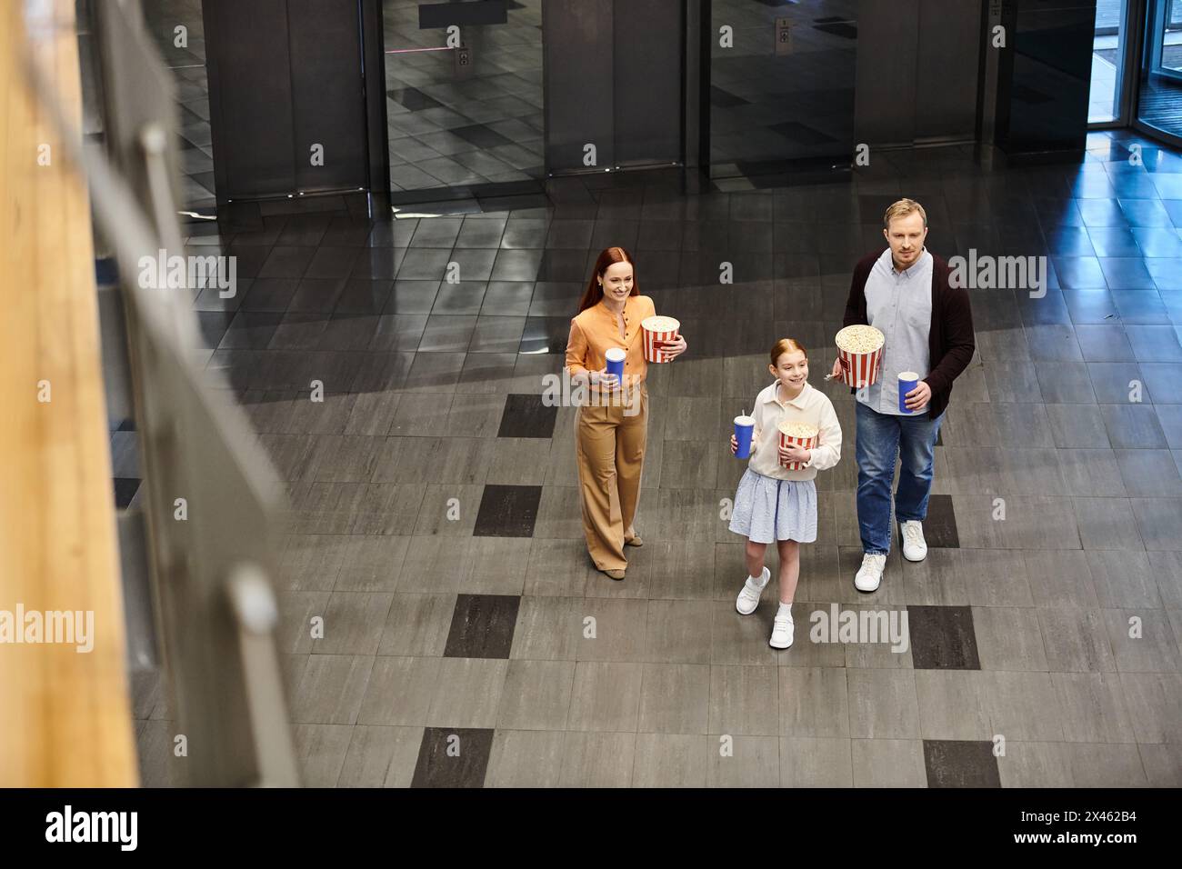 A diverse group of people stand happily together on a colorful tiled ...