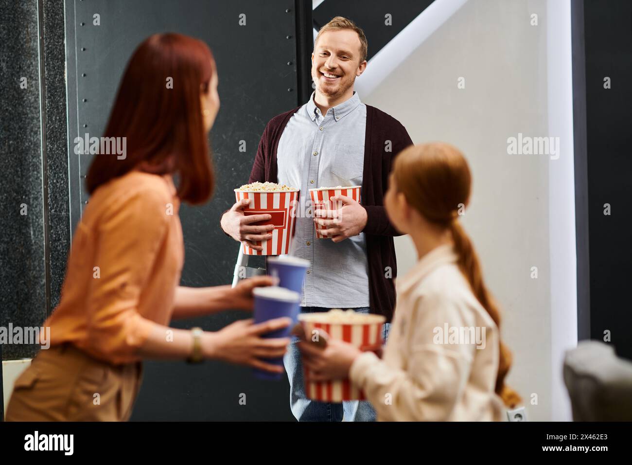 A joyful family stands in a circle, connecting with each other with ...