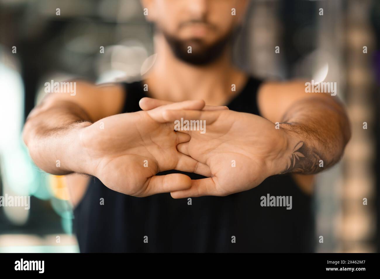 Cropped of Man Holding Hands Together in Front of Him Stock Photo - Alamy