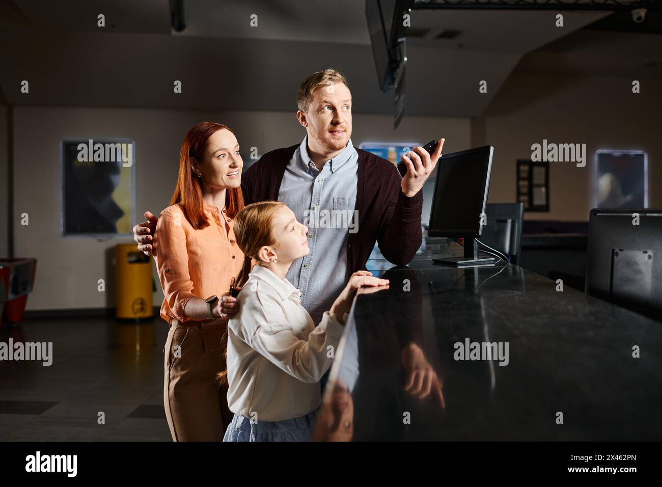 A diverse group of people gather around, engrossed in discussion and ...