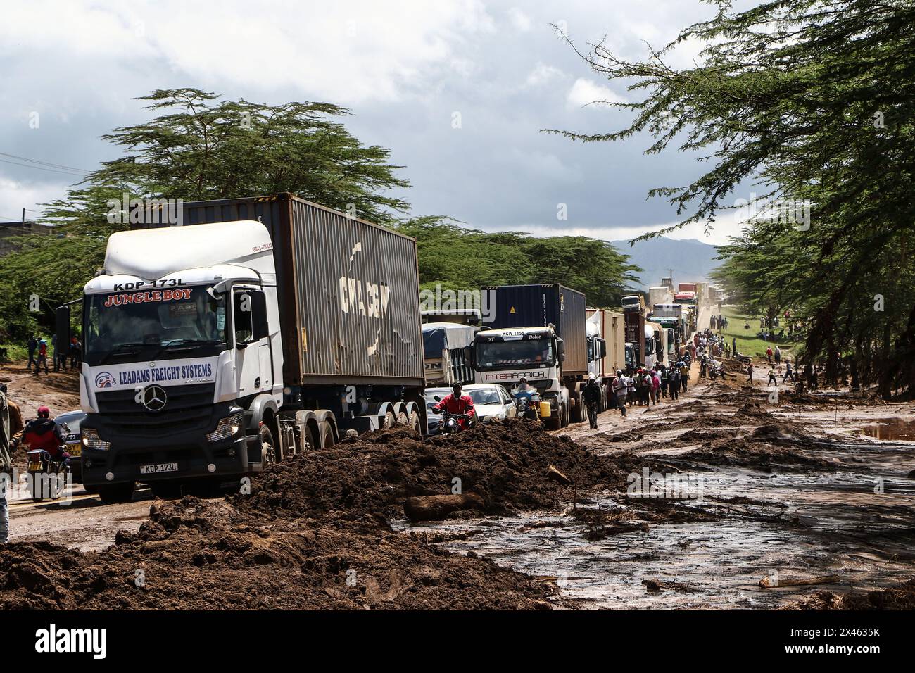 A long line of trucks stuck in traffic are seen during the flooding ...