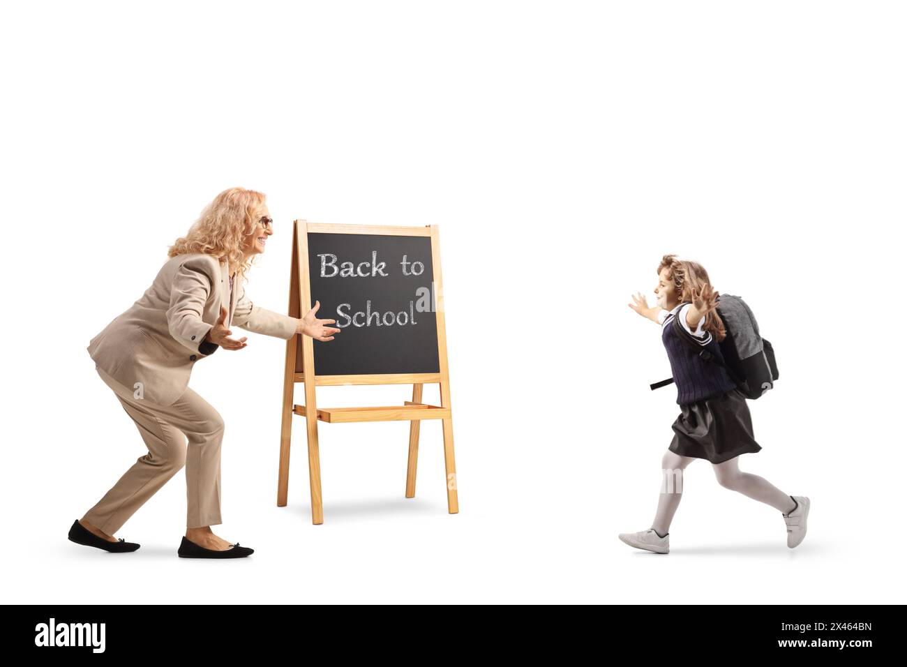 Schoolgirl running back to school, teacher waiting with arms wide open ...