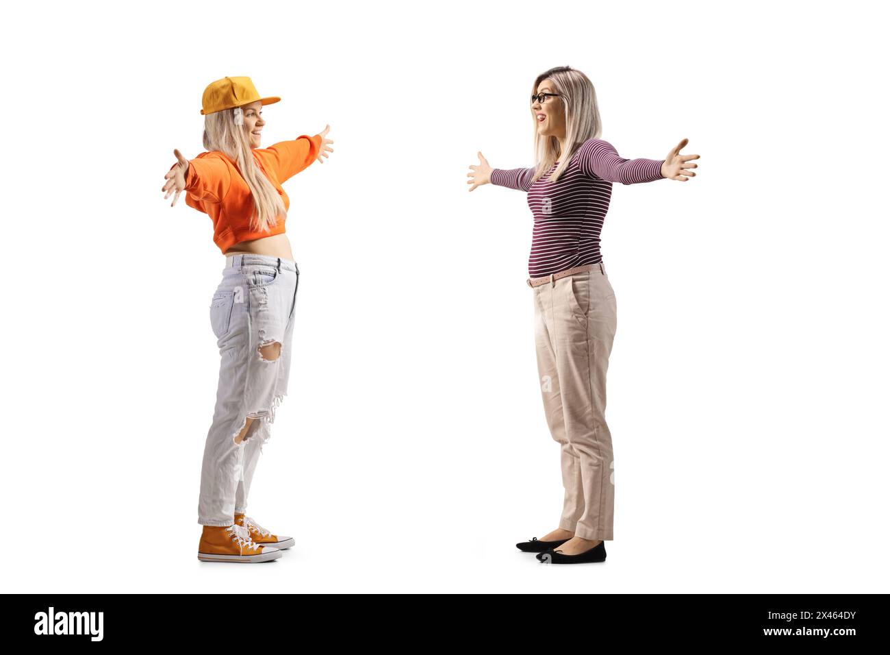 Full length profile shot of two female friends meeting isolated on ...