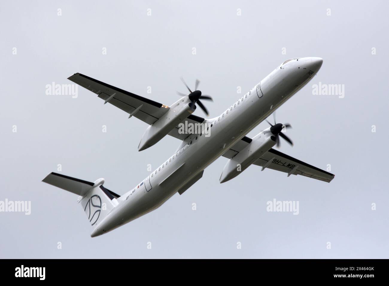 A de Havilland Dash8-Q400 aircraft of Luxwing departing Gatwick Airport ...