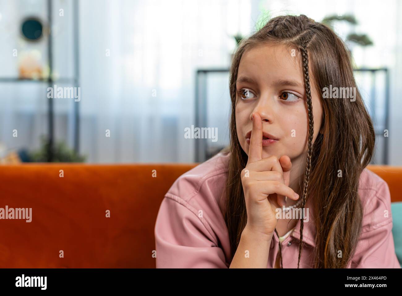 Shh be quiet please. Portrait of preteen girl child presses index ...