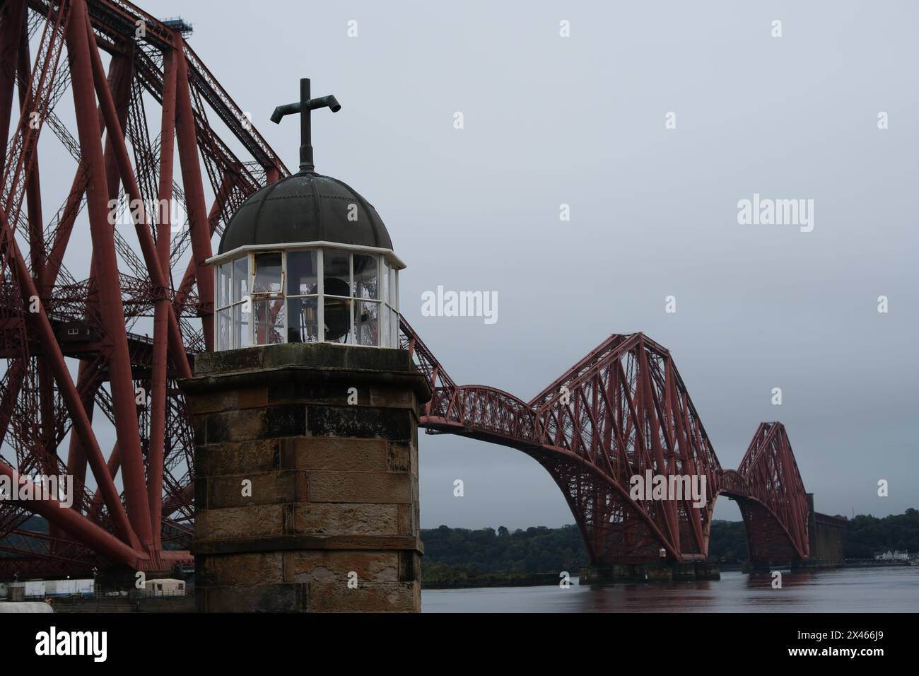 Amazing structure of Firth of forth railway bridge with a picturesque lighthouse on the ...