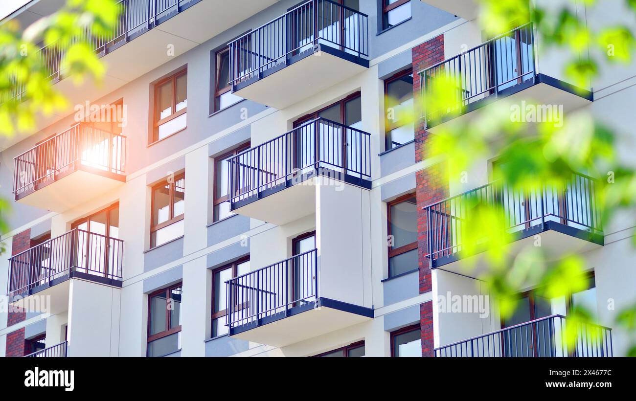 Modern residential building with new apartments in a green residential ...