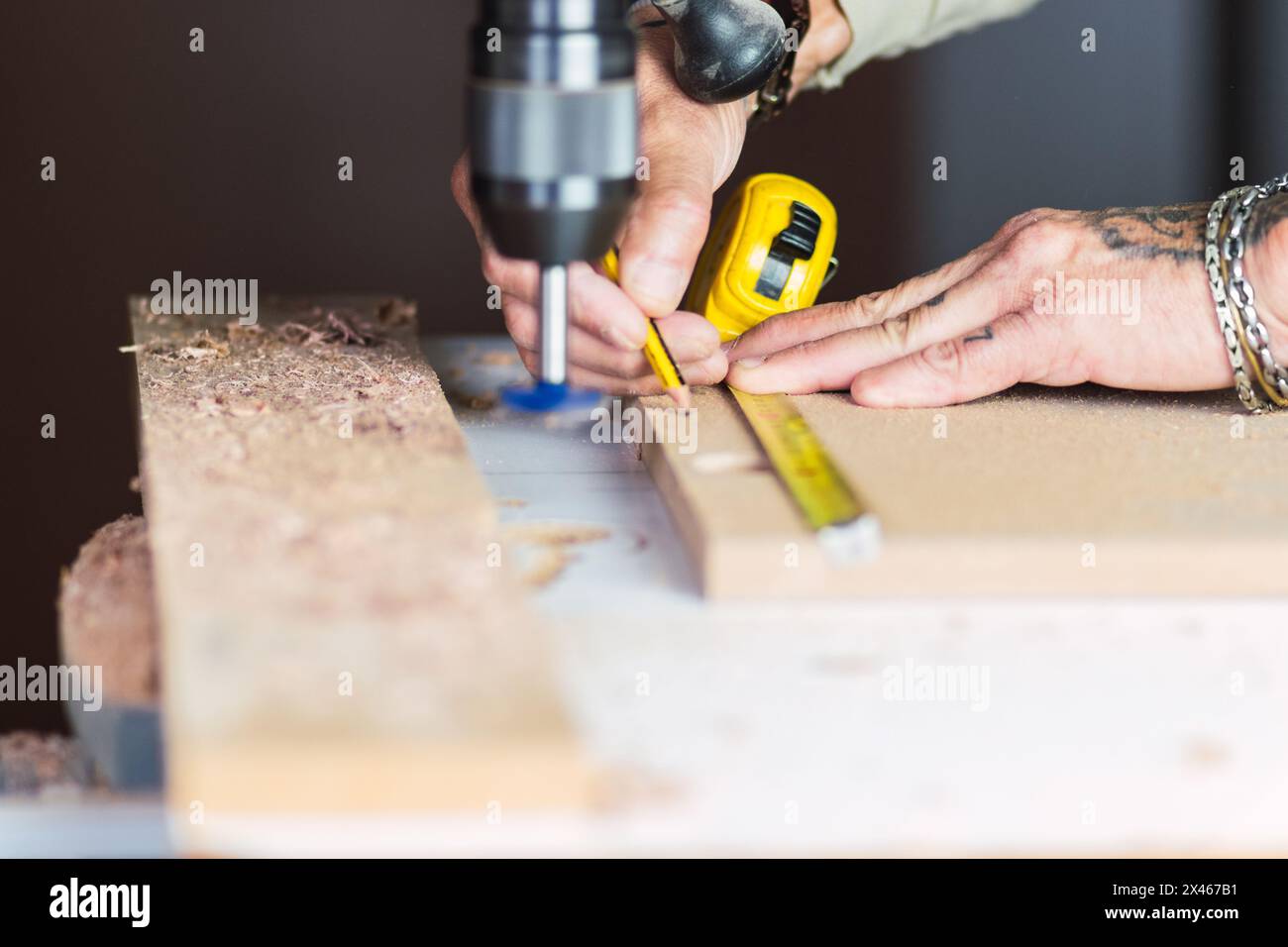 Crop faceless tattooed male master without a thumb measuring piece of ... Crop faceless tattooed male master without a thumb measuring piece of ...